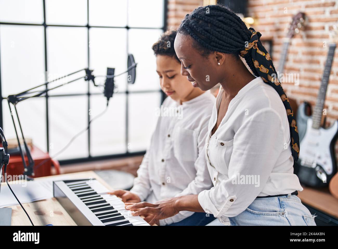 African child playing piano hi-res stock photography and images - Alamy