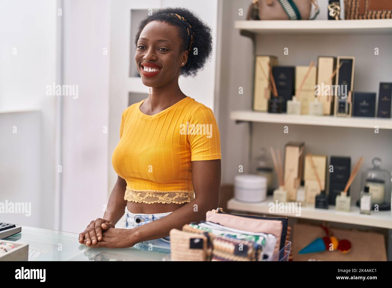 African american woman shop assistant using computer working at ...