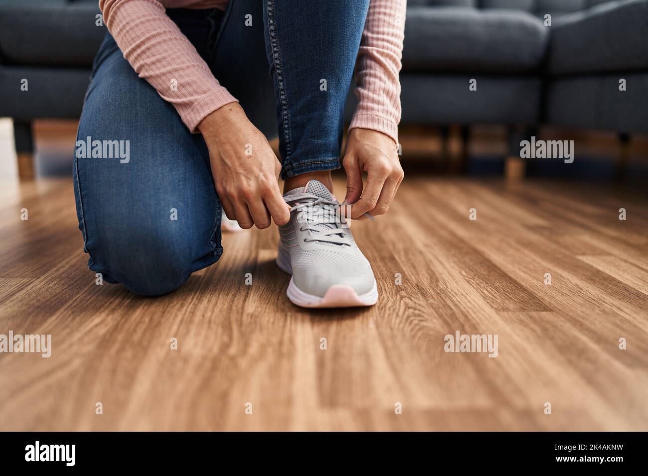 Woman tying knot string hi-res stock photography and images - Alamy