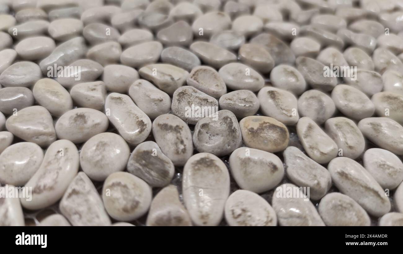 White and grey pebble stone texture wall as a background Stock Photo ...