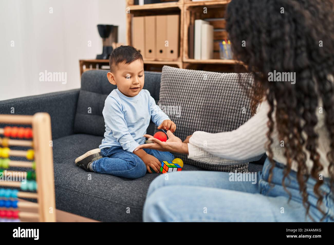 Mother and son having educational therapy at pedagogue center Stock ...