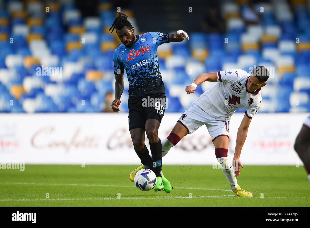 André-Frank Anguissa of SSC Napoli and Sasa Lukic of Torino FC compete ...