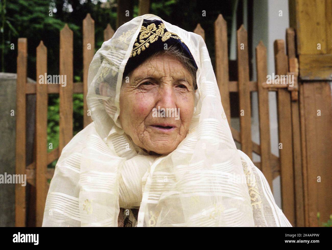 Nucsoara, Arges County, Romania, approx. 2000. Elderly woman wearing a ...