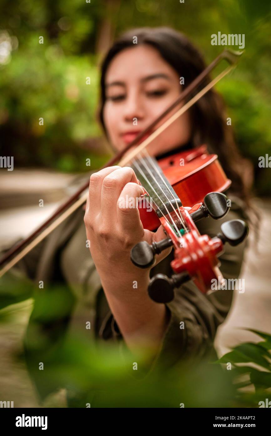 Lifestyle of girl with her violin playing a melody outdoors, Concept of ...