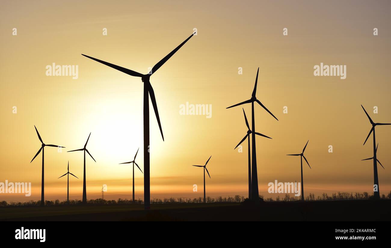 Eco-friendly wind turbine at sunrise in Saxony, Germany Stock Photo - Alamy