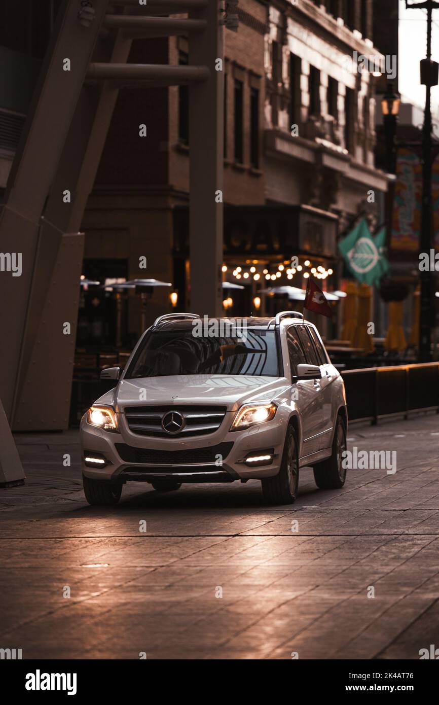 A white Mercedes Benz driving downtown Calgary, Alberta Stock Photo - Alamy