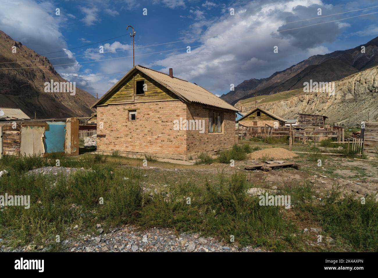 Dilapidated houses in abandoned ghost town Enilchek in South East ...