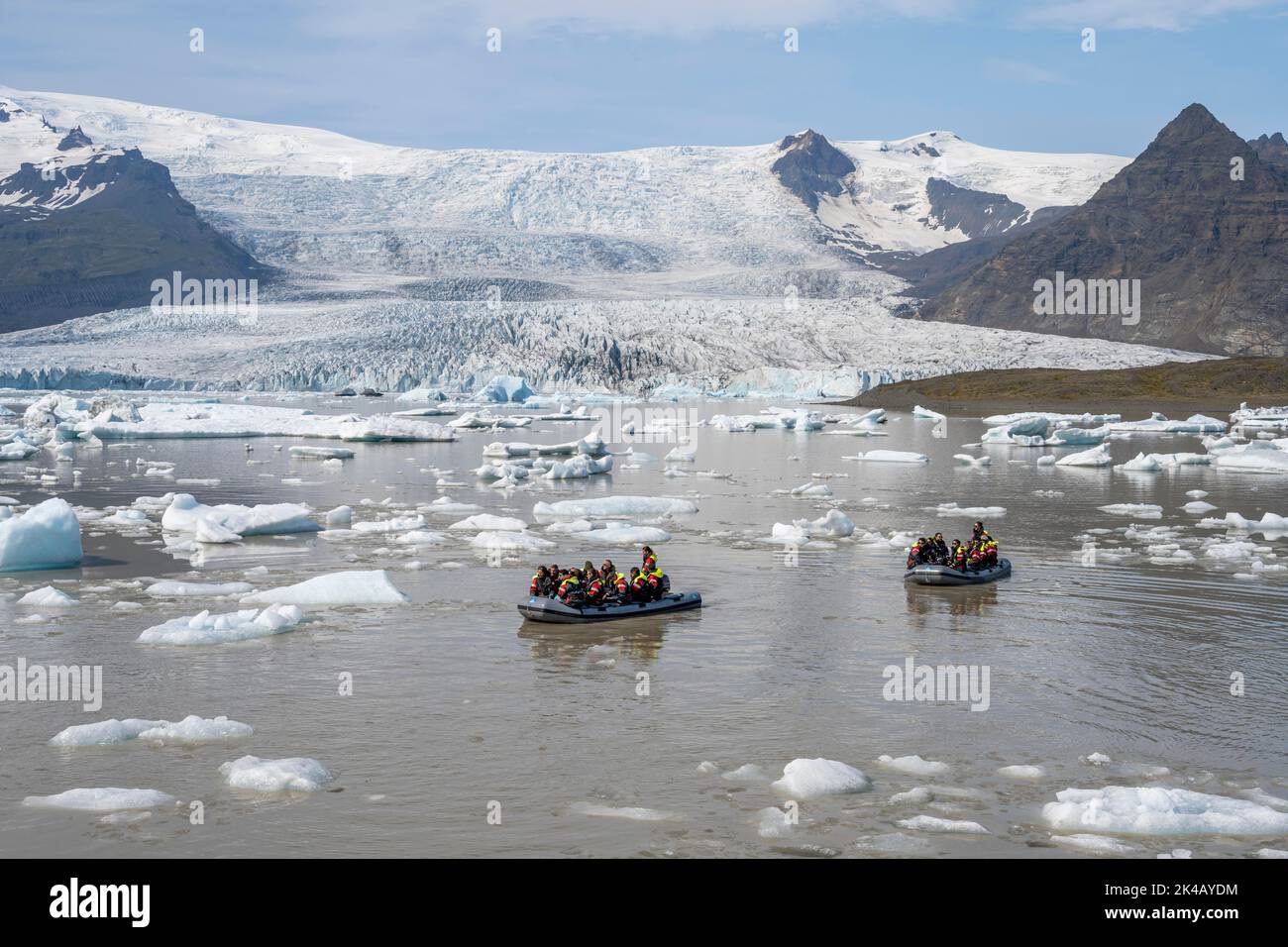 Boats with tourists in the glacier lagoon, ice lagoon Fjallsarlon, ice ...