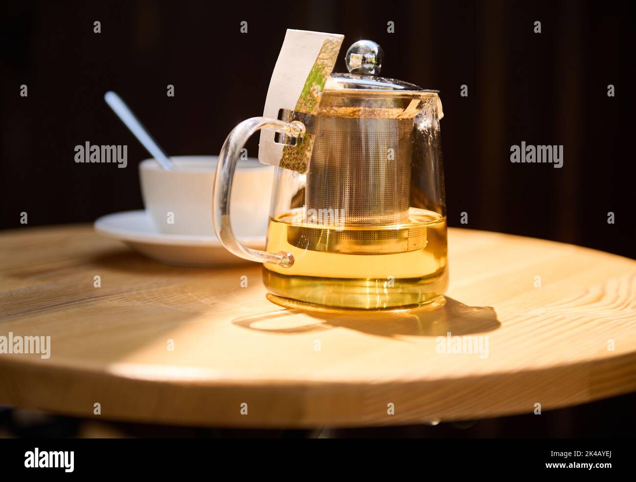 Front shot. A teapot with healthy antioxidant herbal, green tea on a ...