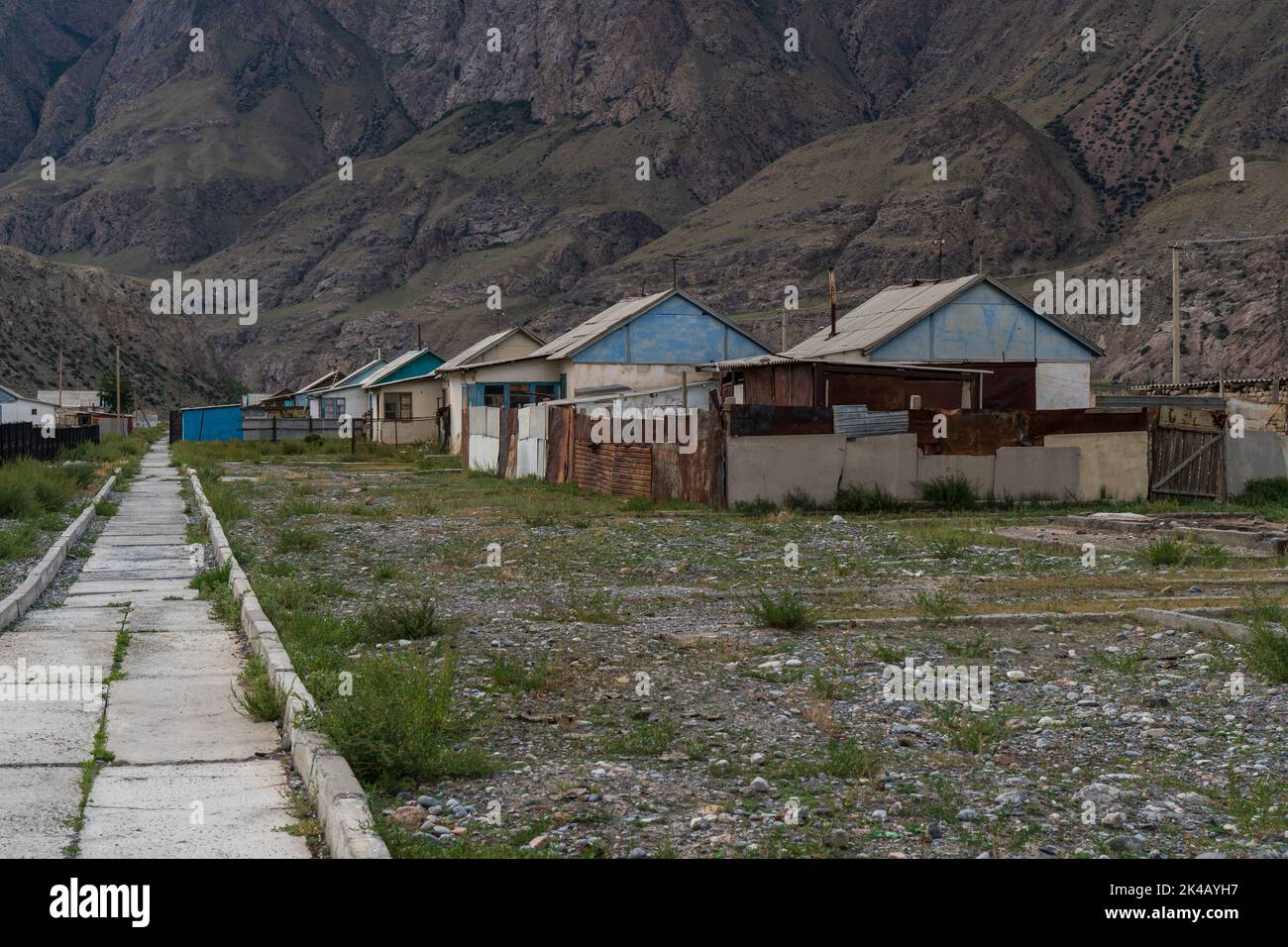 Dilapidated houses in abandoned ghost town Enilchek in South East ...