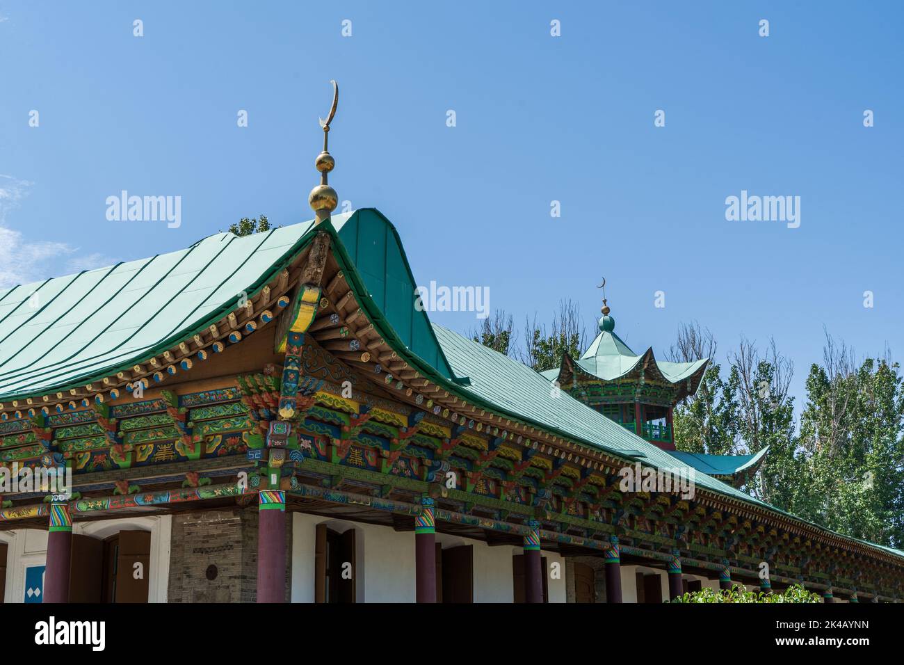 Colourful timber exterior structure and pagoda of Chinese Dungan Uyghur ...