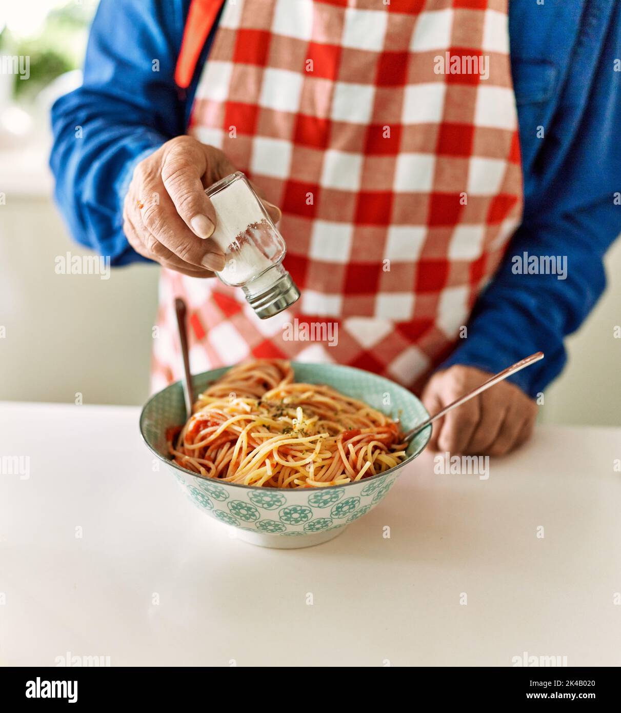 Person plate pouring salt hi-res stock photography and images - Alamy