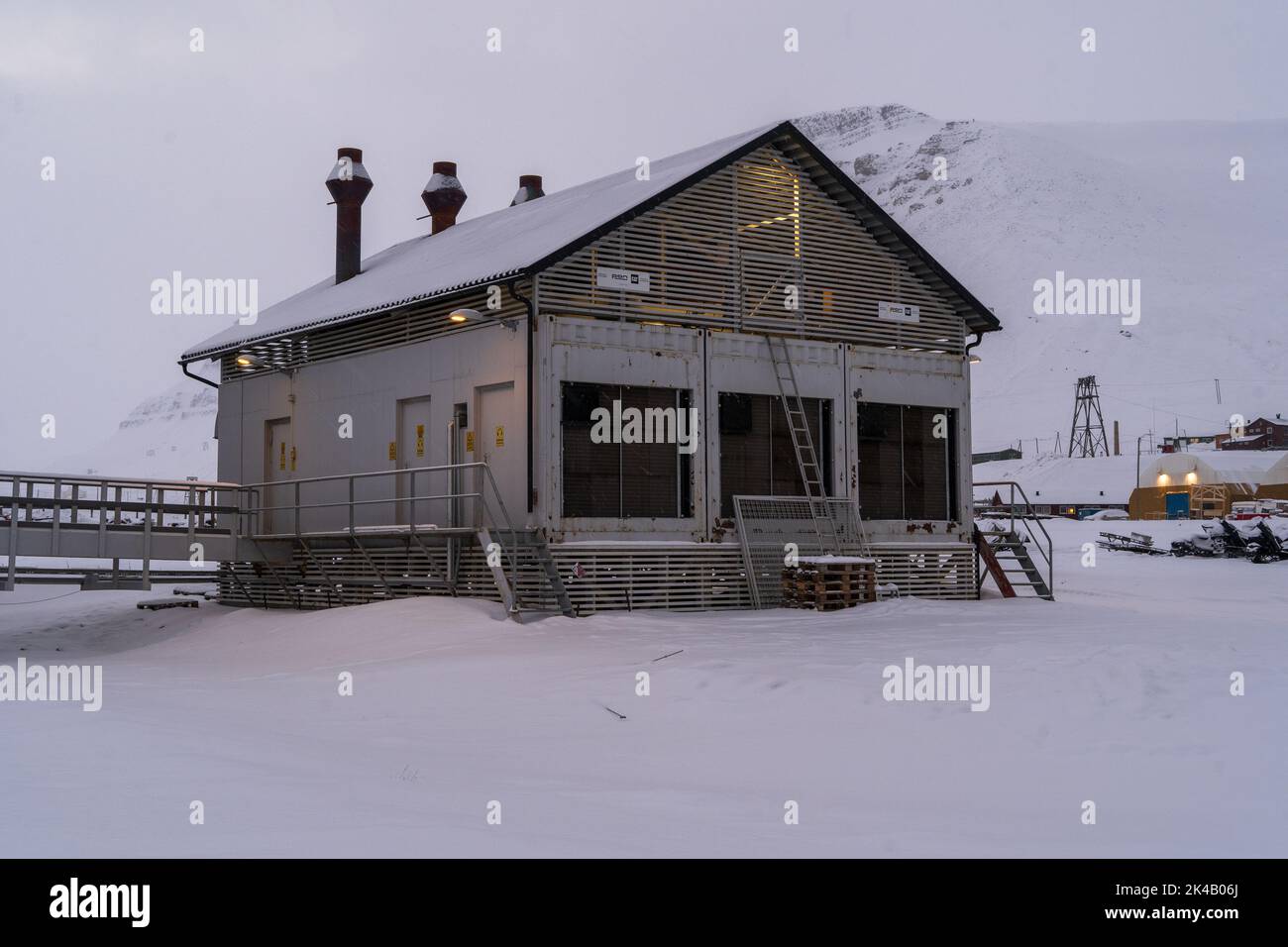 Raised boiler house in Longyearybyen on snowy winter day, Svalbard ...