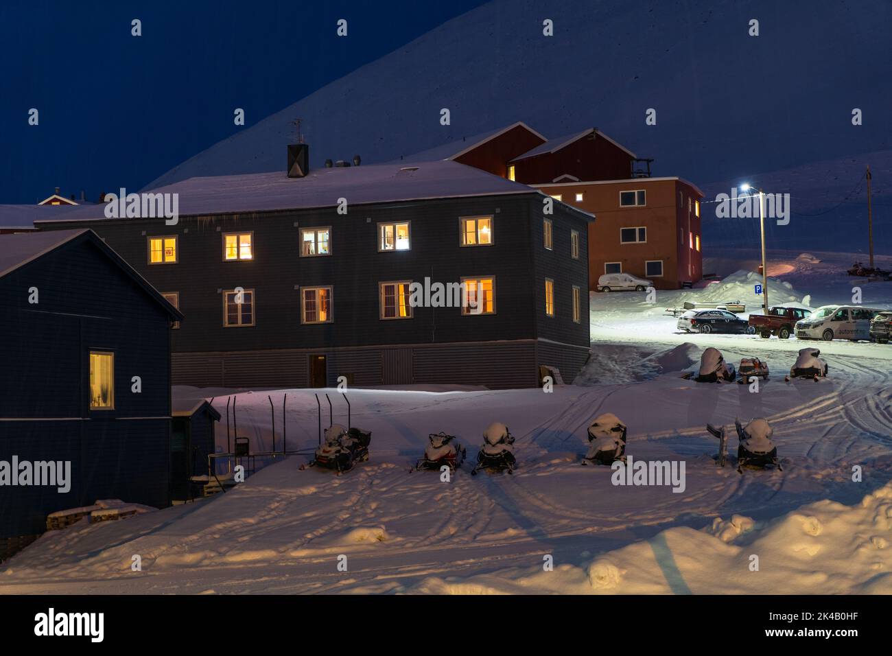 Residential buildings on cold winter snowy evening in Longyearbyen ...