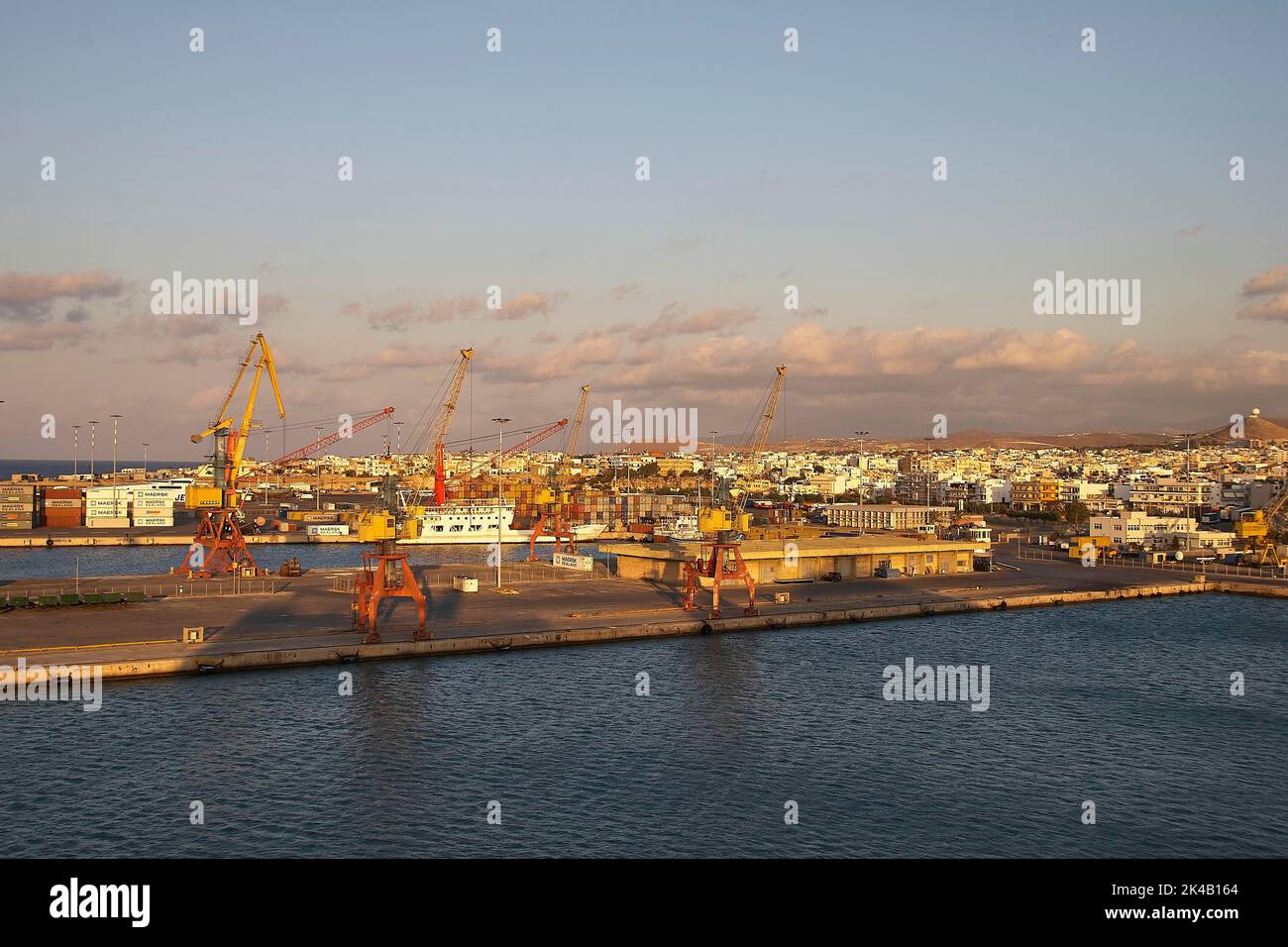 Evening light, loading cranes, harbour, blue sky, white grey clouds ...