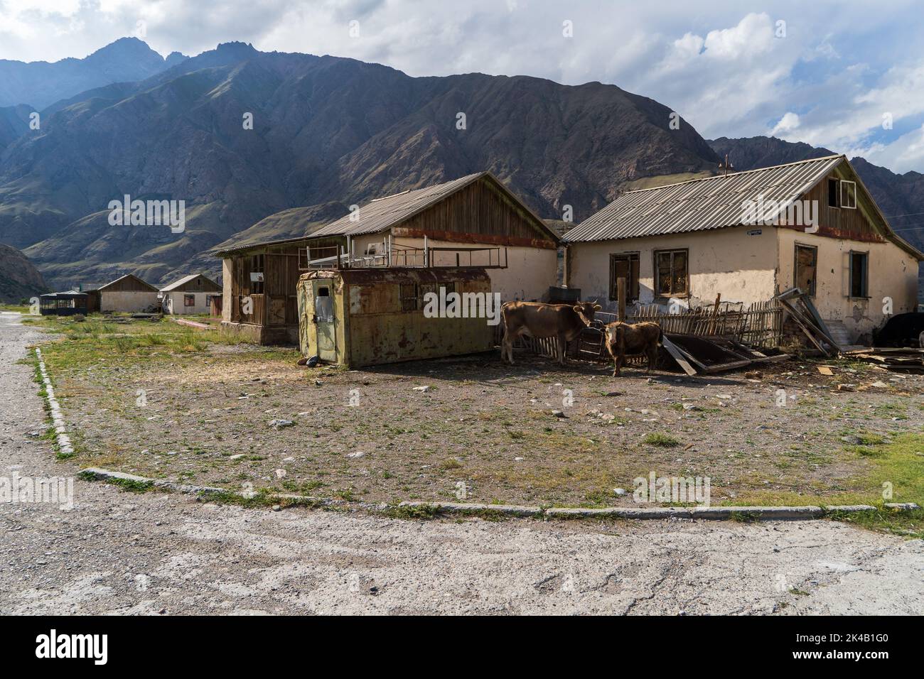 Dilapidated houses in abandoned ghost town Enilchek in South East ...