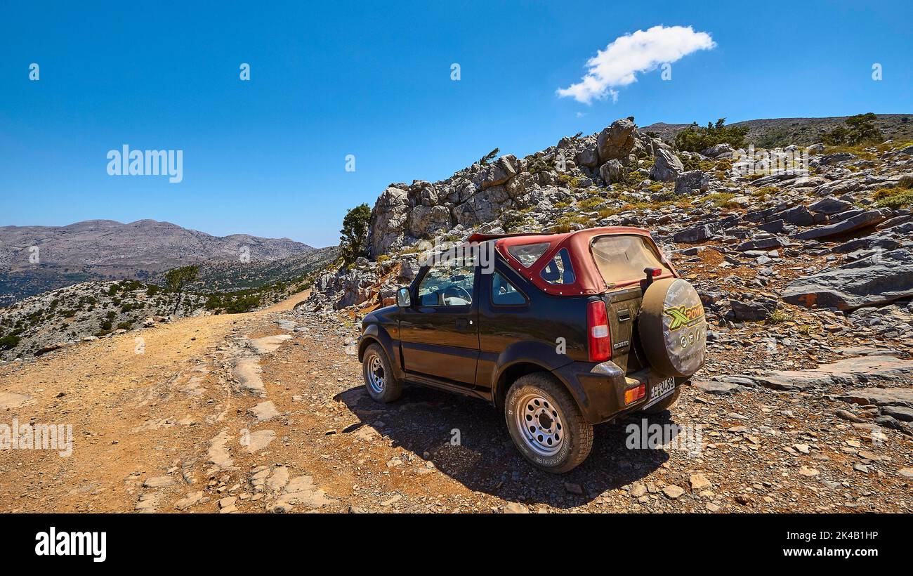 Katharo plateau, jeep on dirt road, rocks, mountains, blue sky, single ...