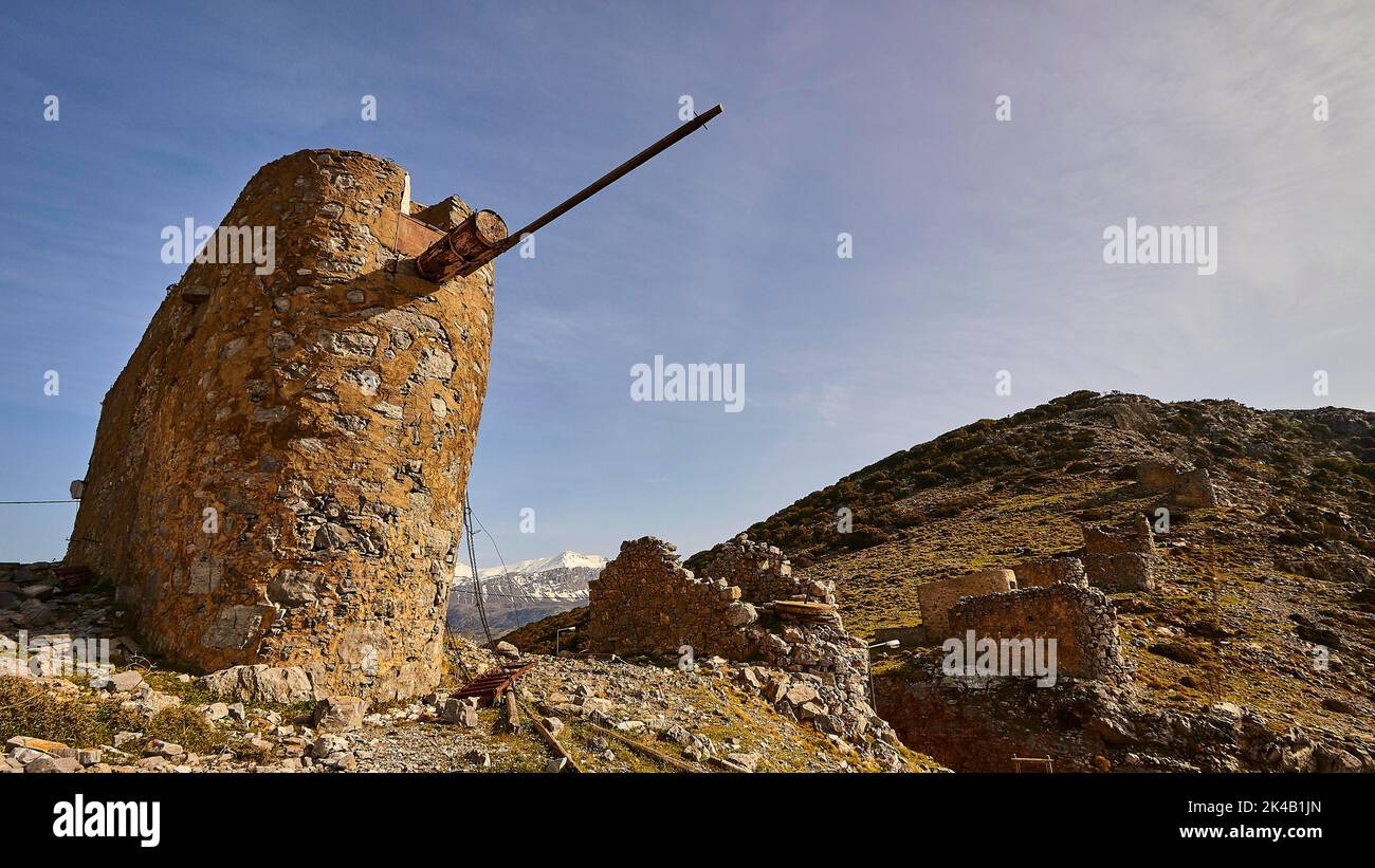 Old windmill, flour mill, windmill ruins, snow-capped mountains ...