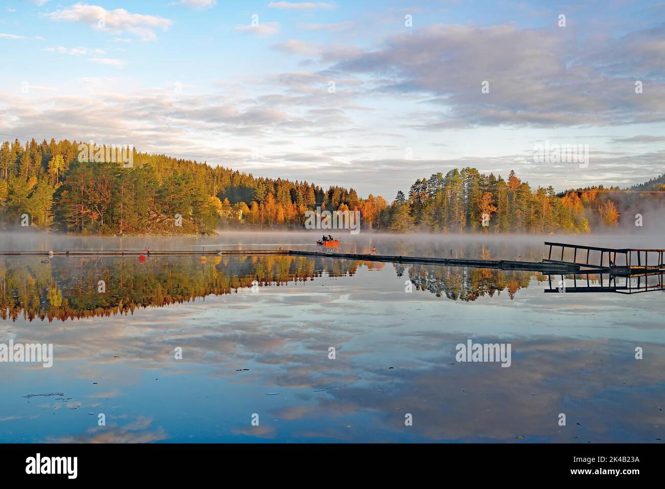 Fog drifts over a calm lake, foliage colouring, October, Bullaren ...