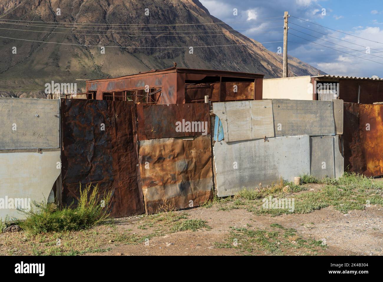 Dilapidated houses in abandoned ghost town Enilchek in South East ...