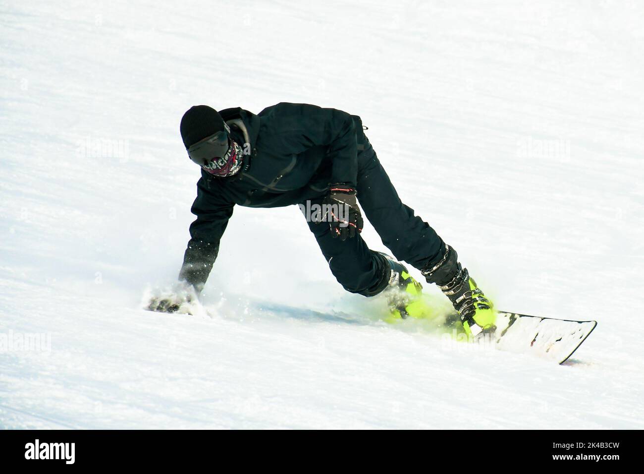Snowboarder on skies downhill. Special winter sports combination .Types ...