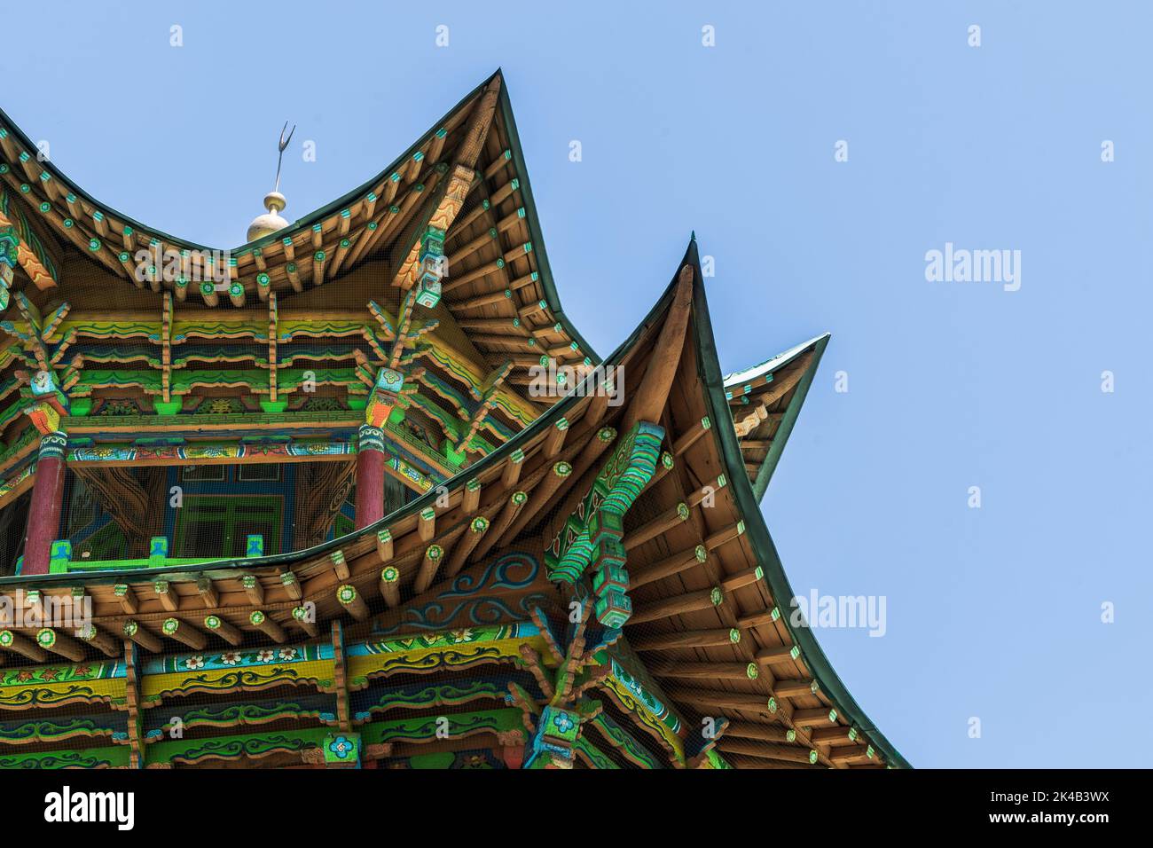 Colourful timber exterior structure and pagoda of Chinese Dungan Uyghur ...