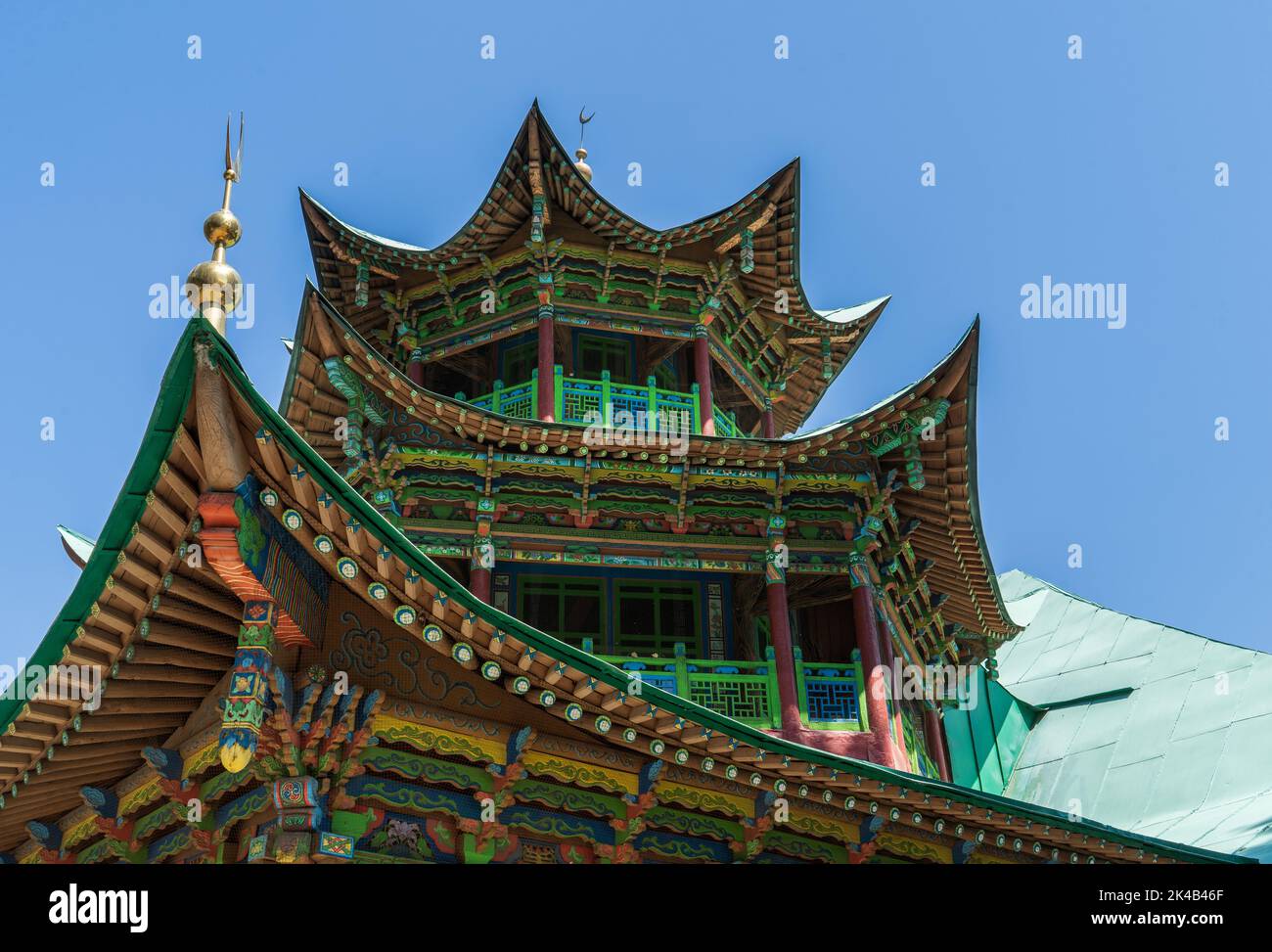 Colourful timber exterior structure and pagoda of Chinese Dungan Uyghur ...