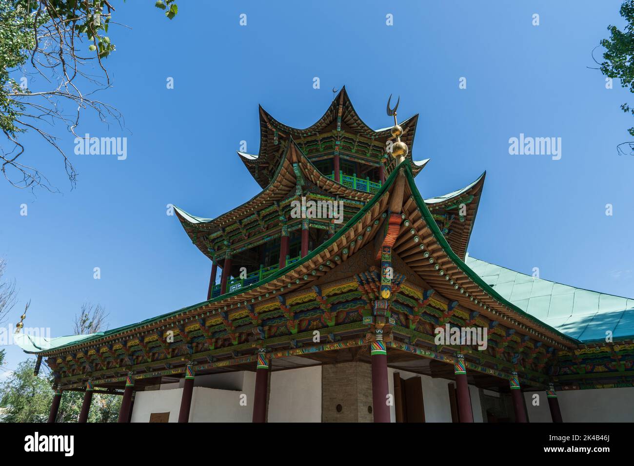 Colourful timber exterior structure and pagoda of Chinese Dungan Uyghur ...
