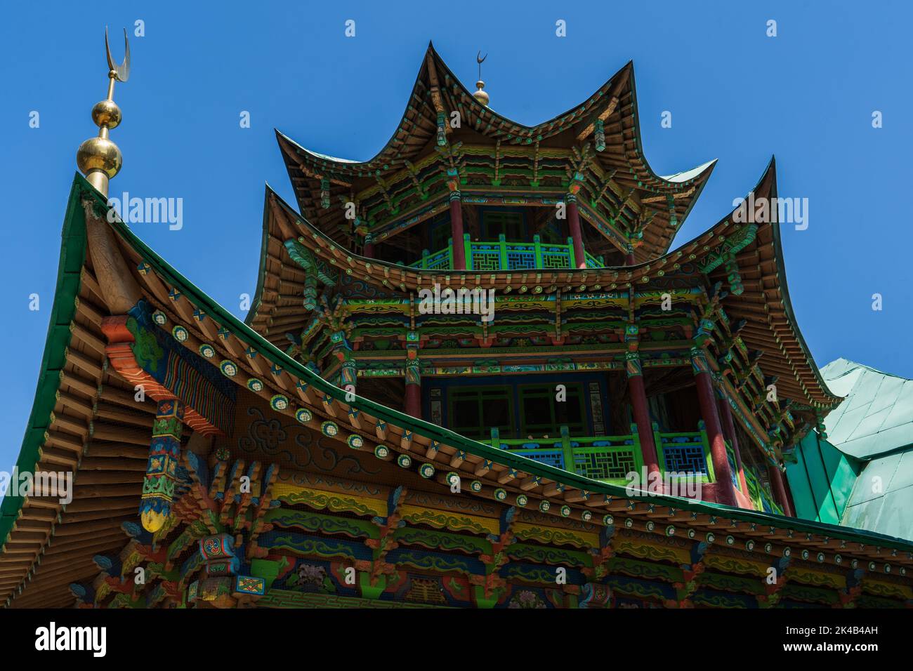 Colourful timber exterior structure and pagoda of Chinese Dungan Uyghur ...