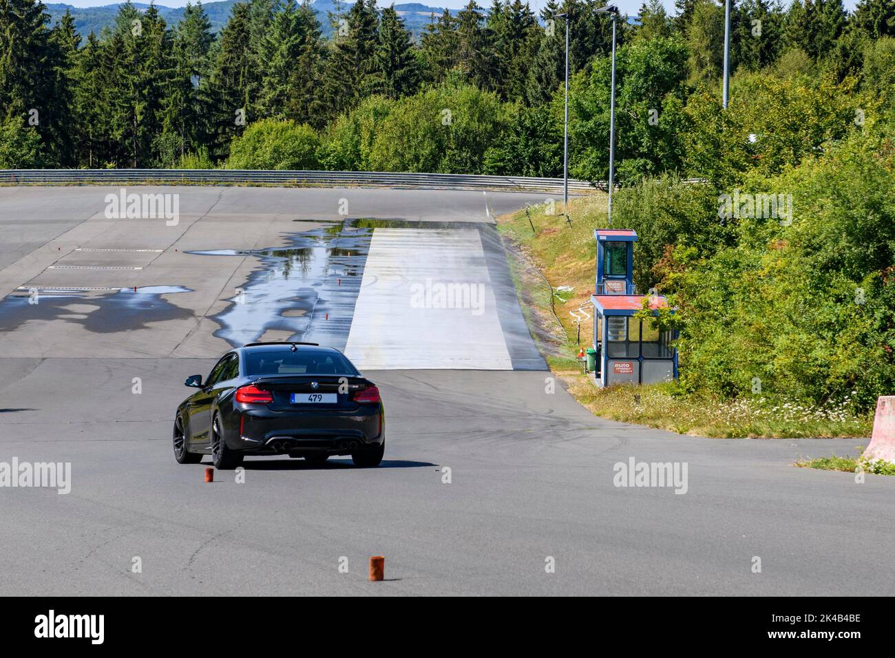 BMW M2 sports car slaloms retains control of vehicle during driving ...