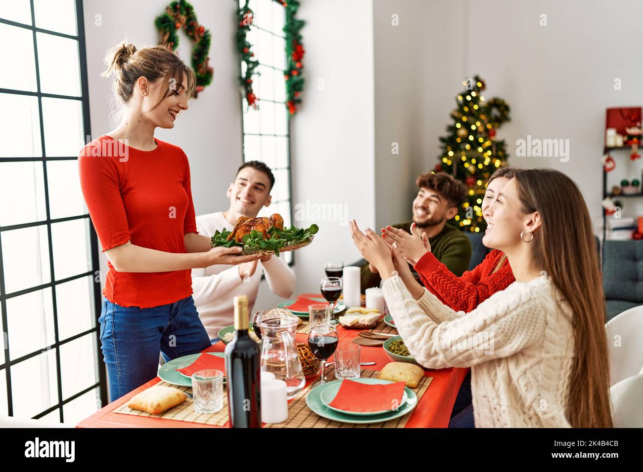 Group of people meeting clapping and sitting on the table. Woman ...