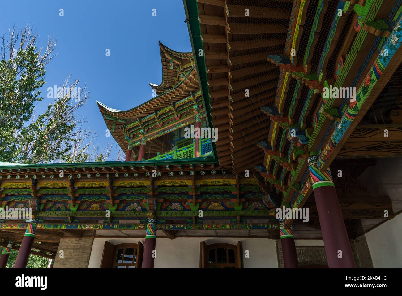 Colourful timber exterior structure and pagoda of Chinese Dungan Uyghur ...