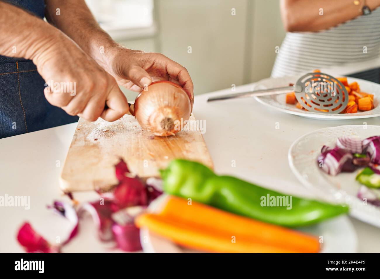 Hispanic mature woman cooking hi-res stock photography and images - Alamy