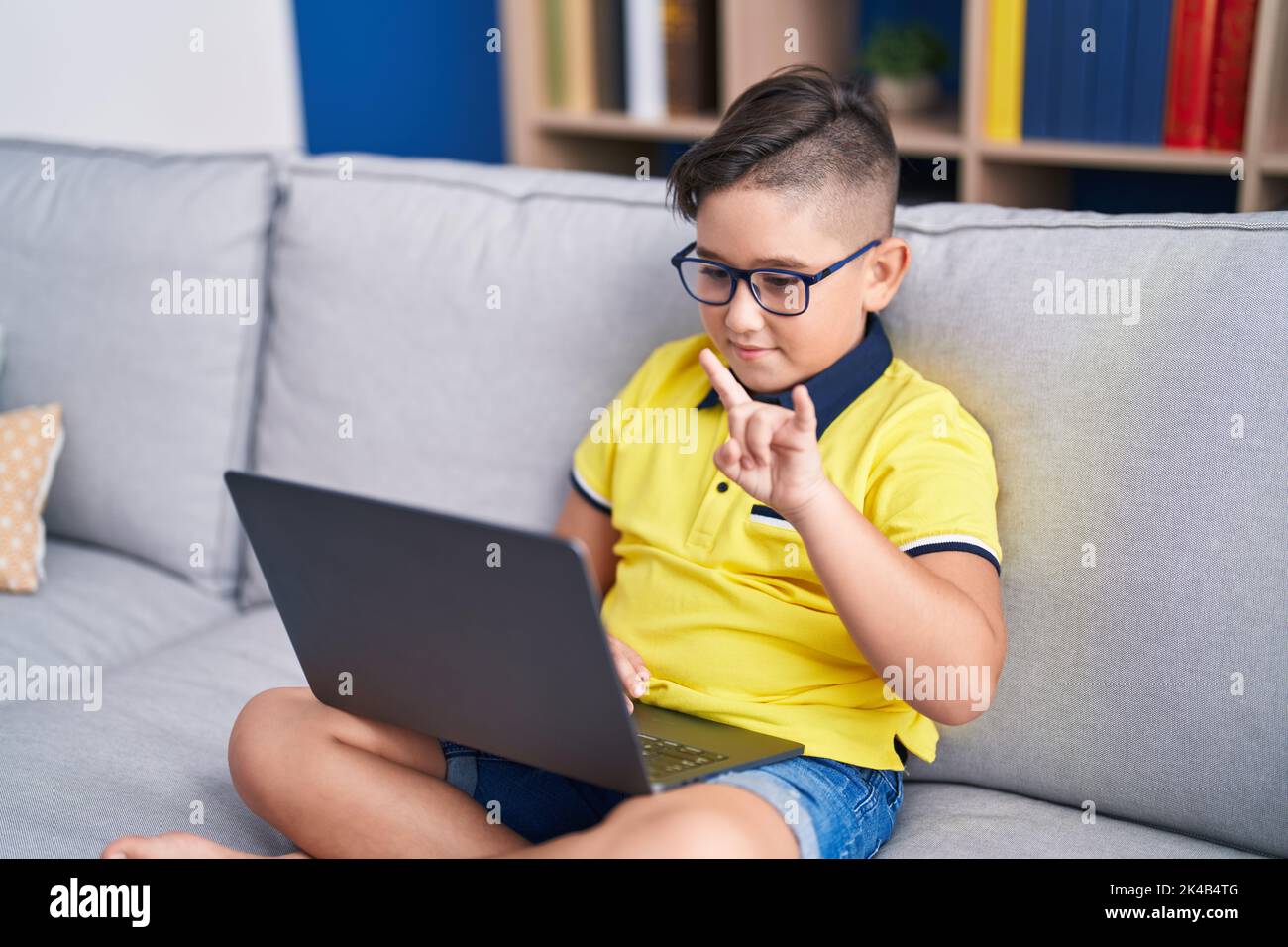 Adorable hispanic boy having video call communicate with sign deaf ...