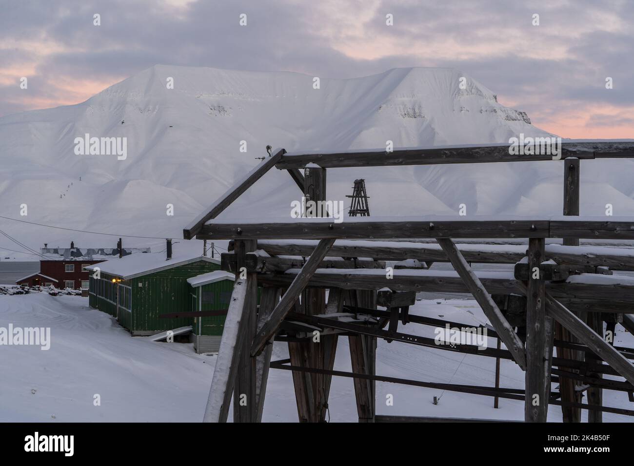 Remains of an old cable car centre above Longyearbyen on a cold winter ...
