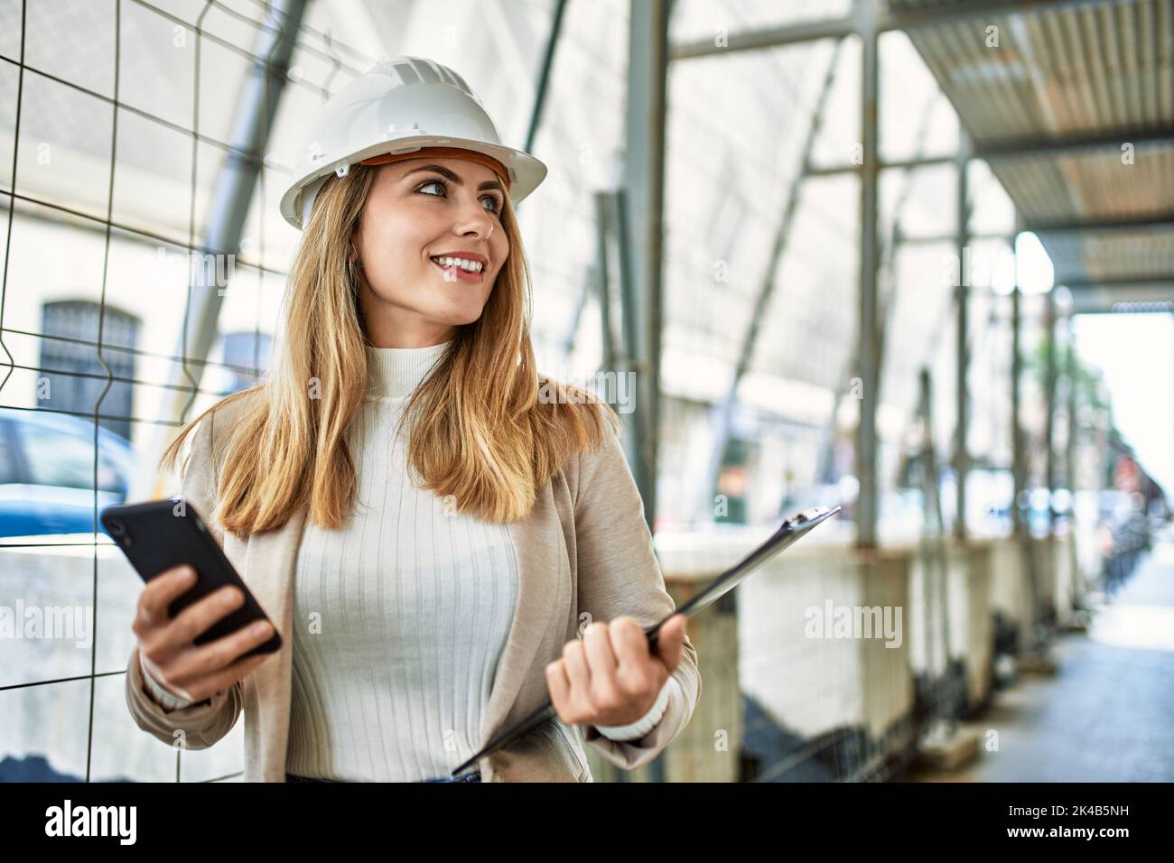 Young blonde woman smiling confident using smartphone at street Stock ...