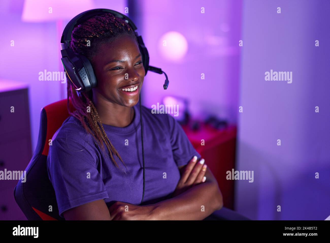 African american woman streamer smiling confident sitting with arms ...