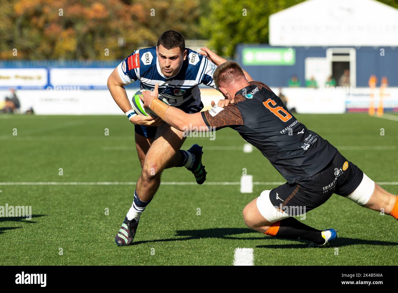 Will Rigg of Coventry Rugby is tackled by Rob Farrar of Ealing ...