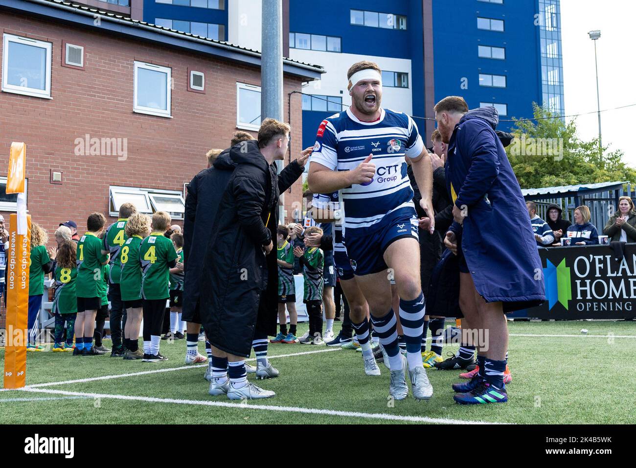 Toby Trinder of Coventry Rugby leads his team onto the pitch before the ...