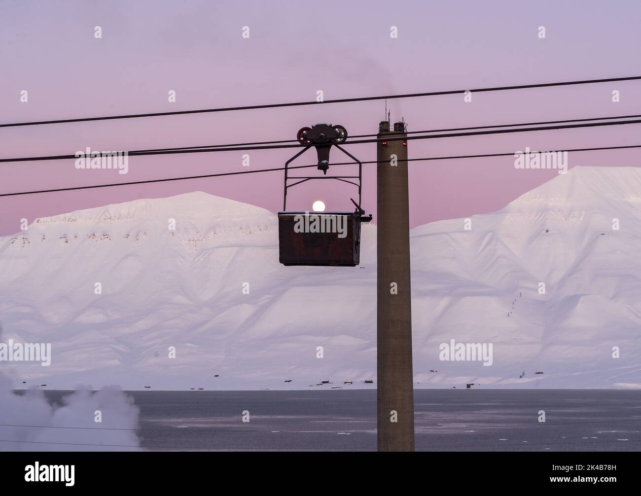 Abandoned decommissioned coal mining industry cable car tower in snowy ...