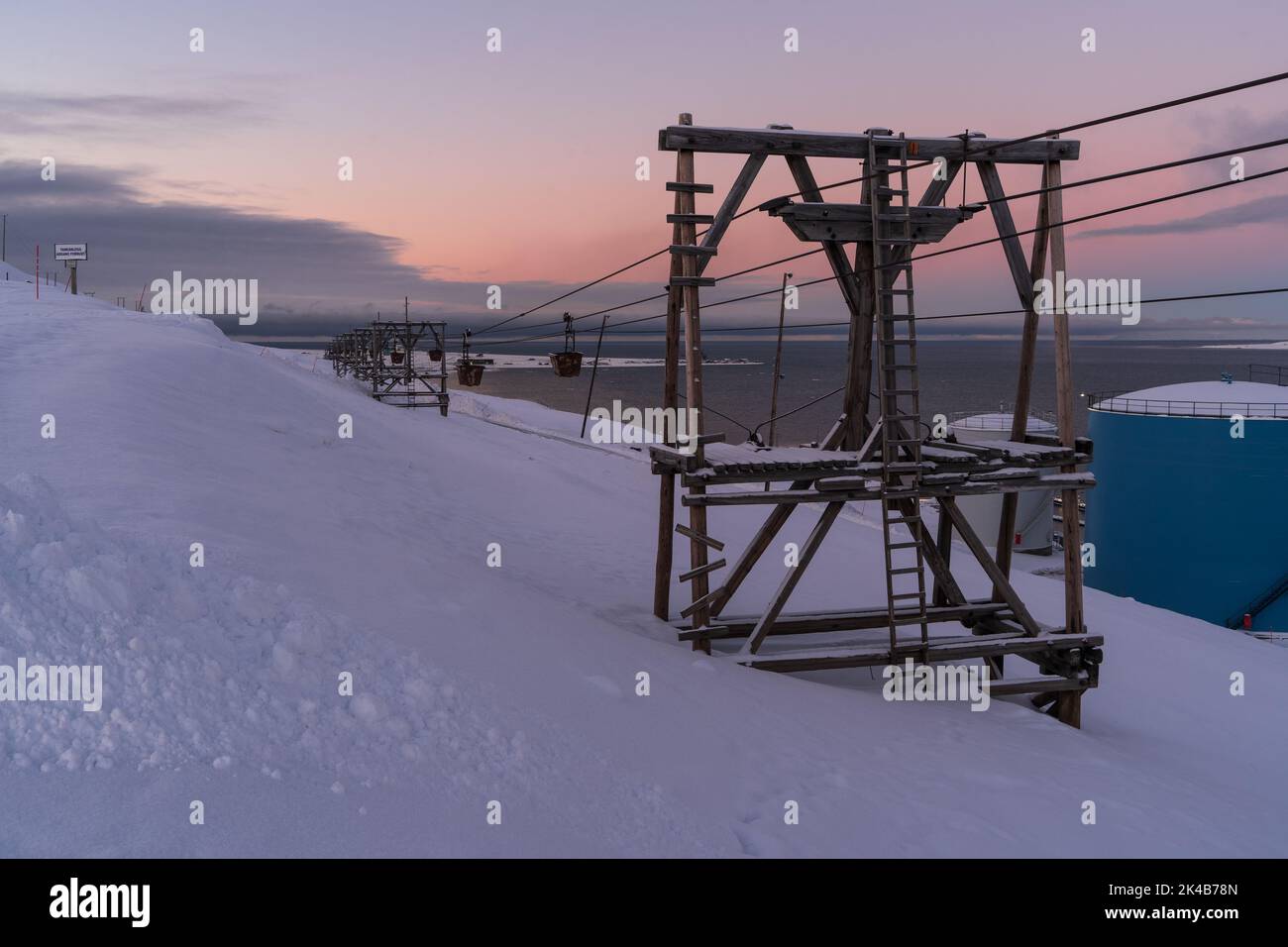 Abandoned decommissioned coal mining industry cable car tower in snowy ...