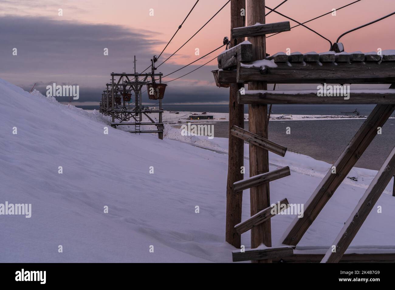 Abandoned decommissioned coal mining industry cable car tower in snowy ...