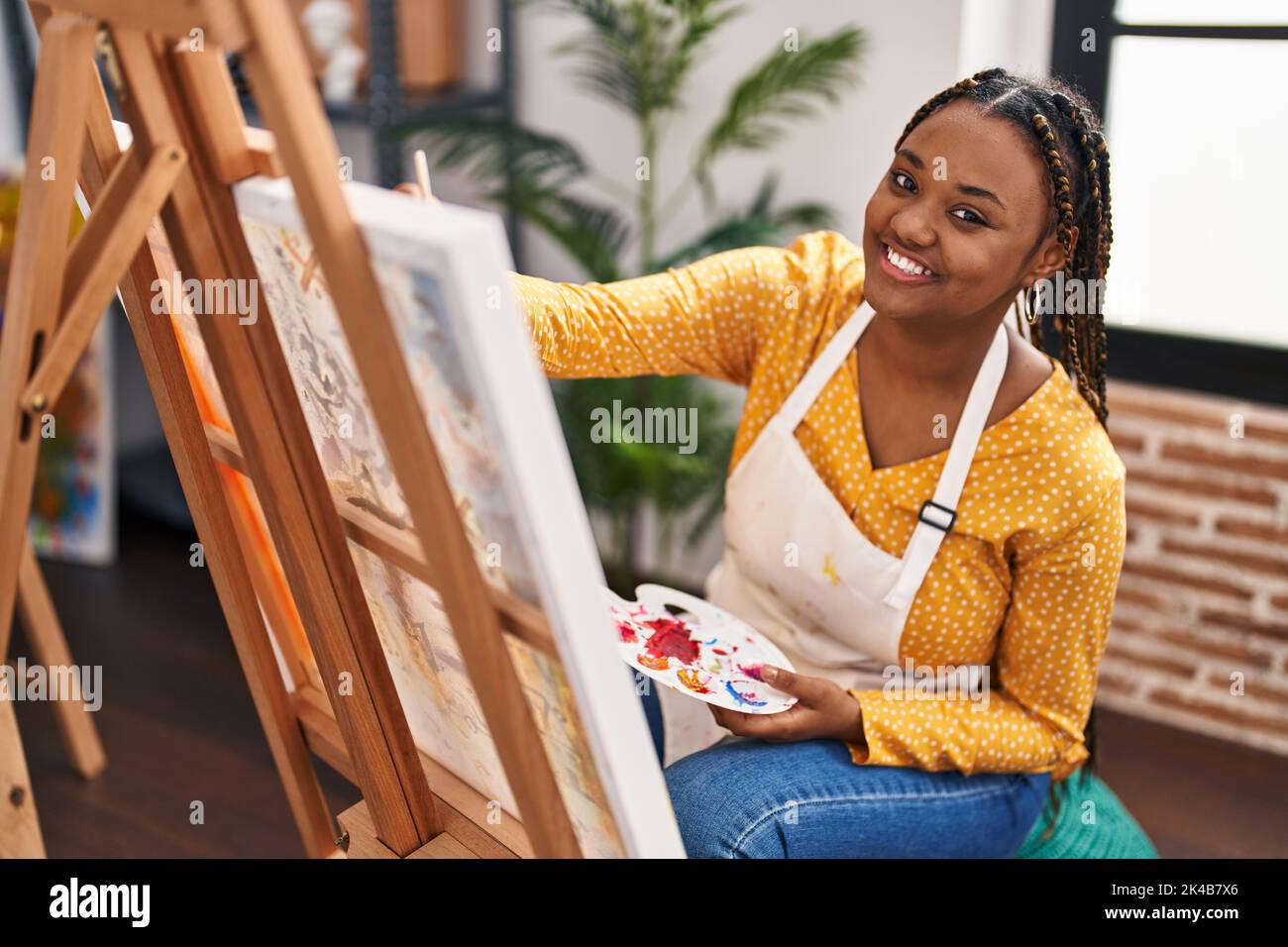 African american woman artist smiling confident drawing at art studio ...
