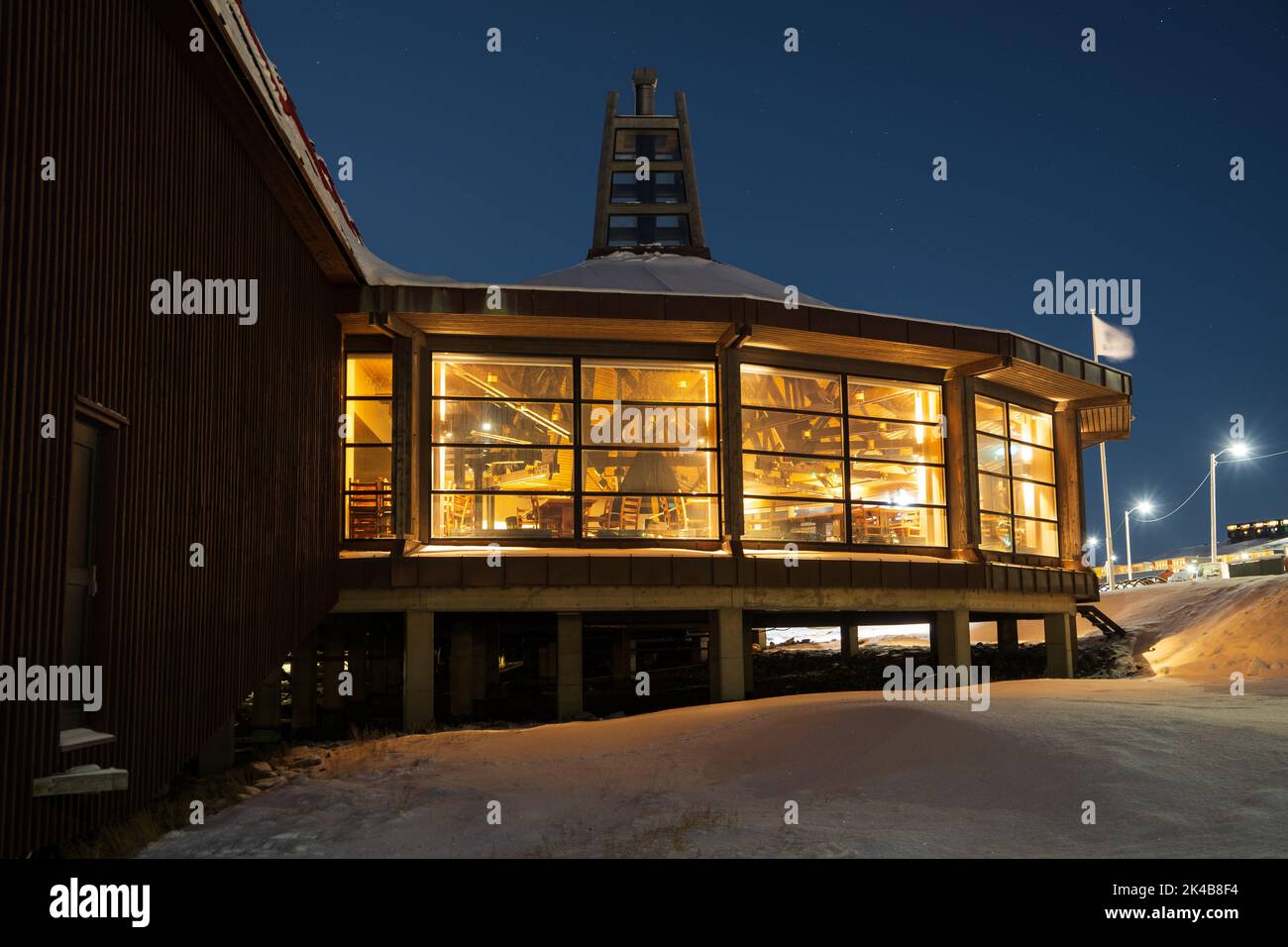 Svalbard University Science Centre at night on raised stilts permafrost ...