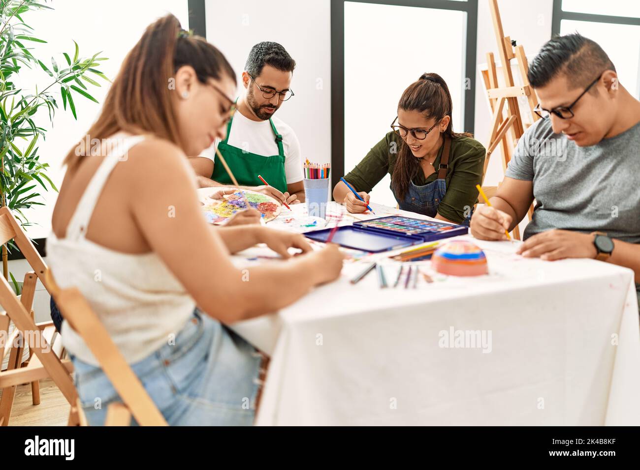 Group of draw students sitting on the table drawing at art studio Stock Photo - Alamy