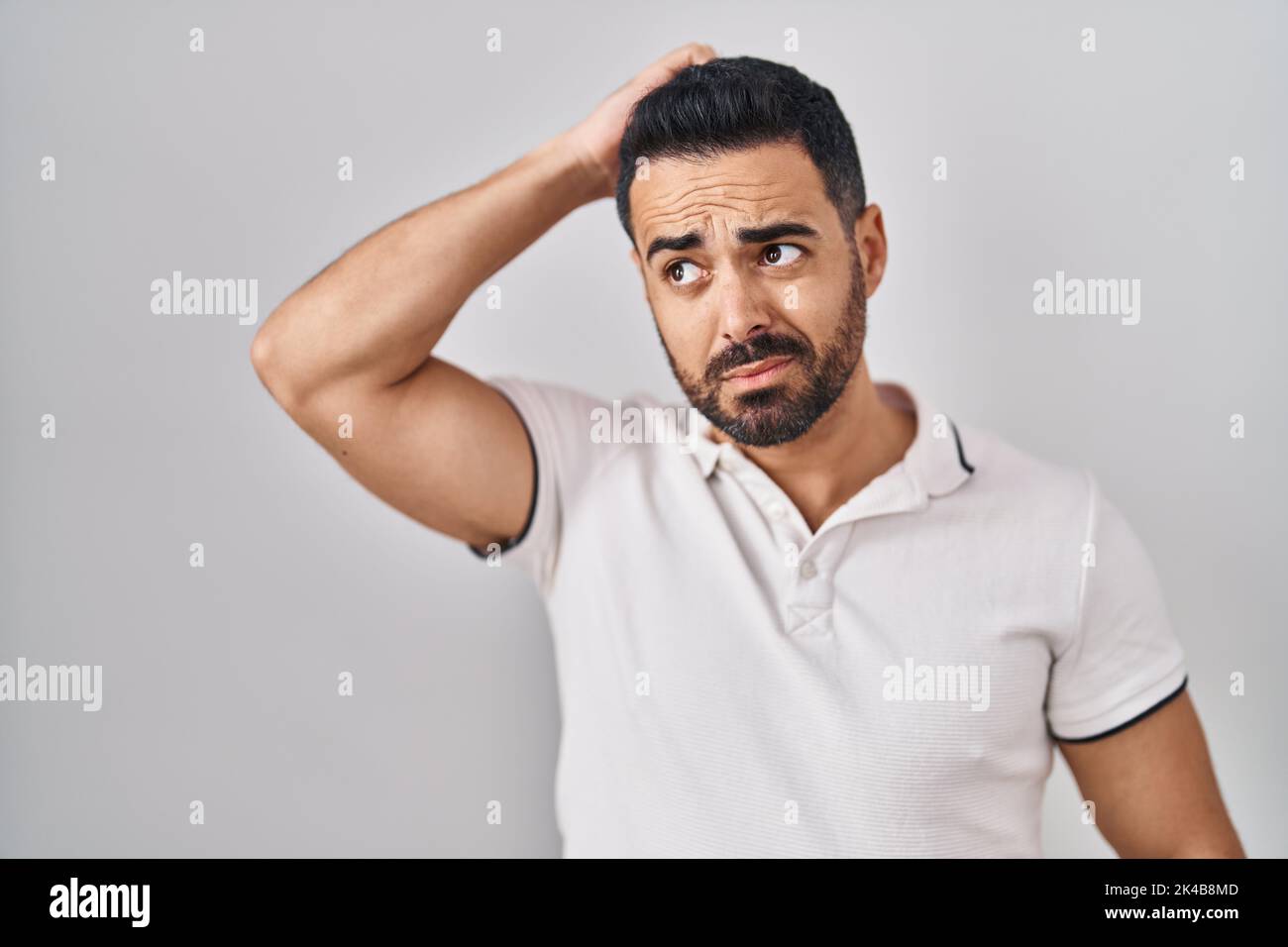 Young hispanic man with beard wearing casual clothes over white ...