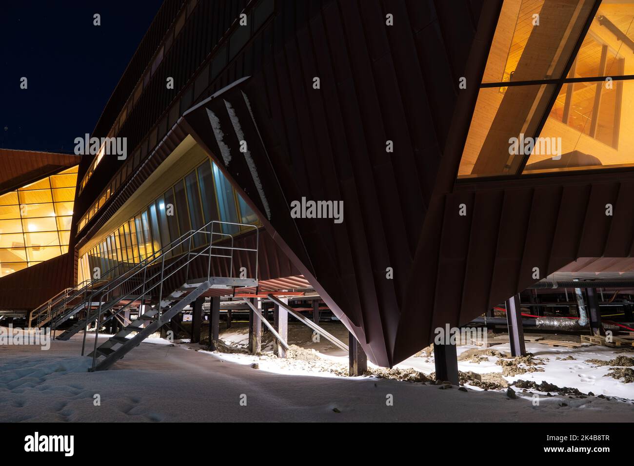 Svalbard University Science Centre at night on raised stilts permafrost ...