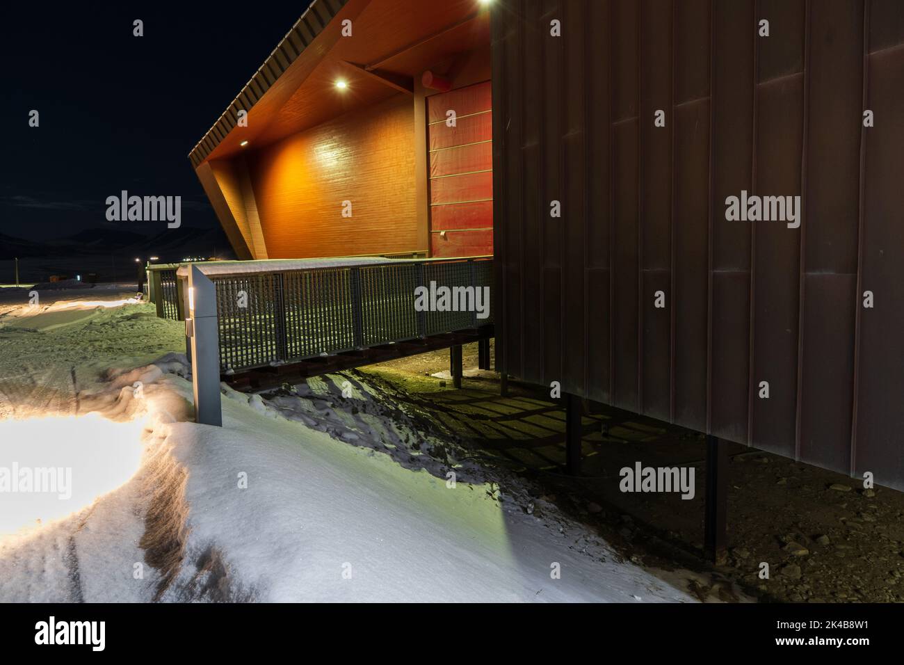 Svalbard University Science Centre at night on raised stilts permafrost ...