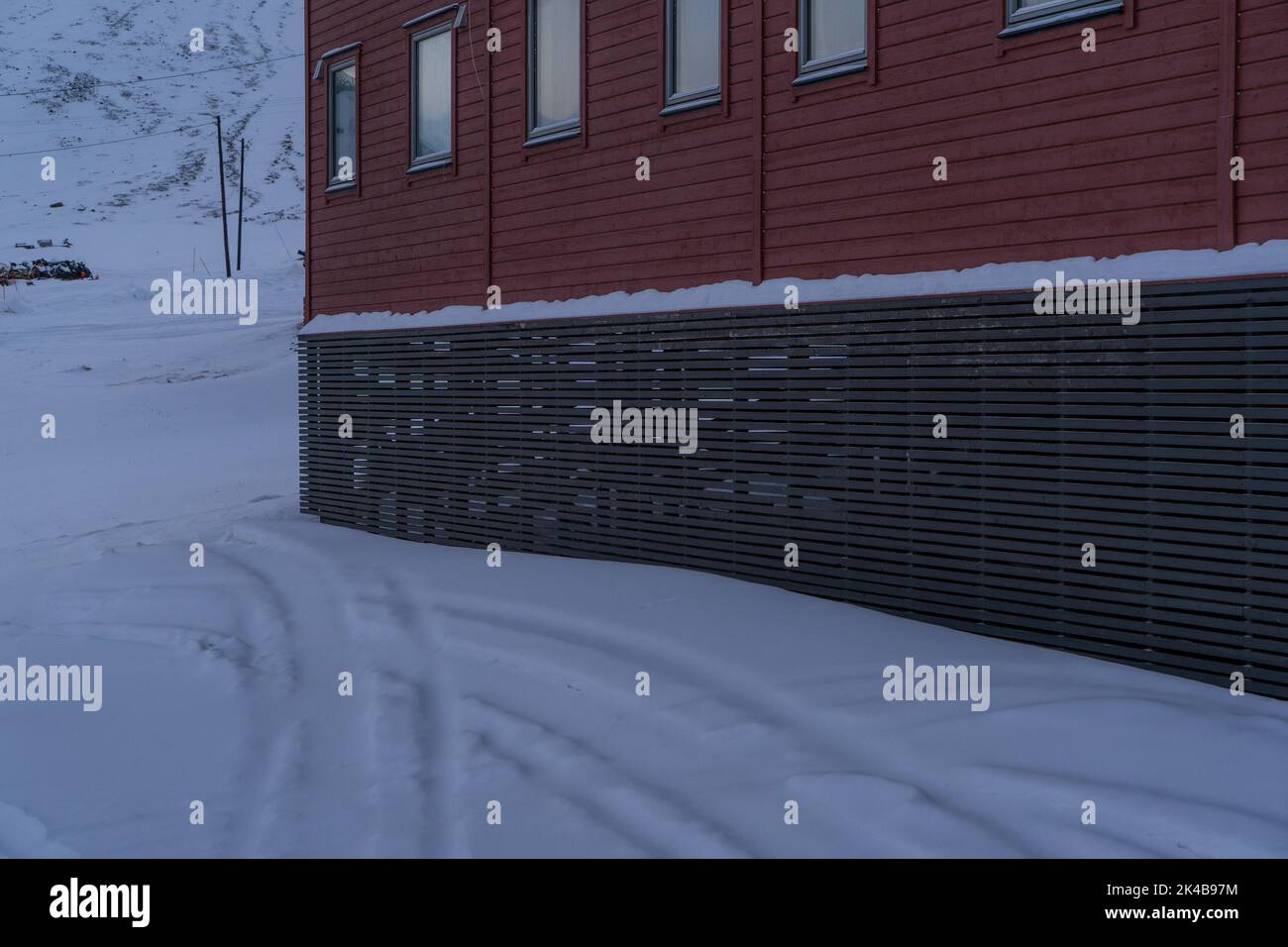Residential buildings on stilts on a cold winter day in Longyearbyen ...