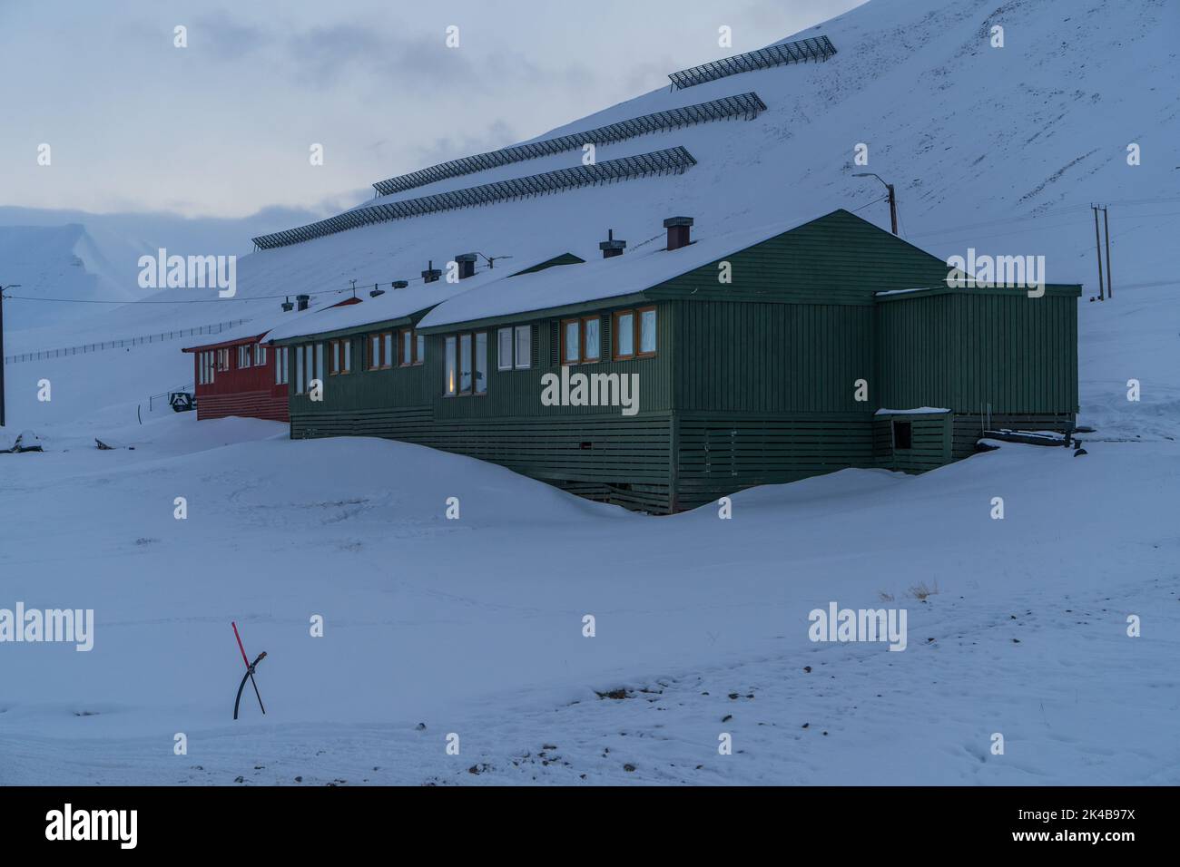 Residential buildings on stilts on a cold winter day in Longyearbyen ...